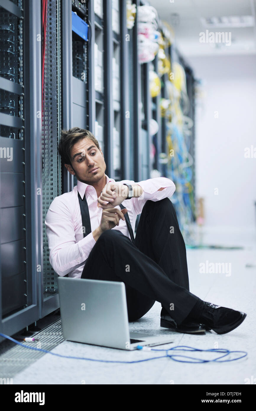 businessman with laptop in network server room Stock Photo - Alamy