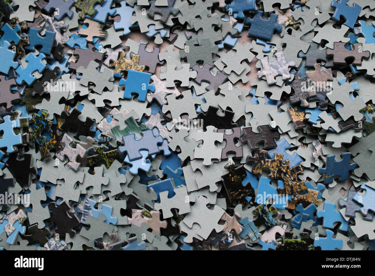blue pieces of puzzle drop on the floor Stock Photo - Alamy