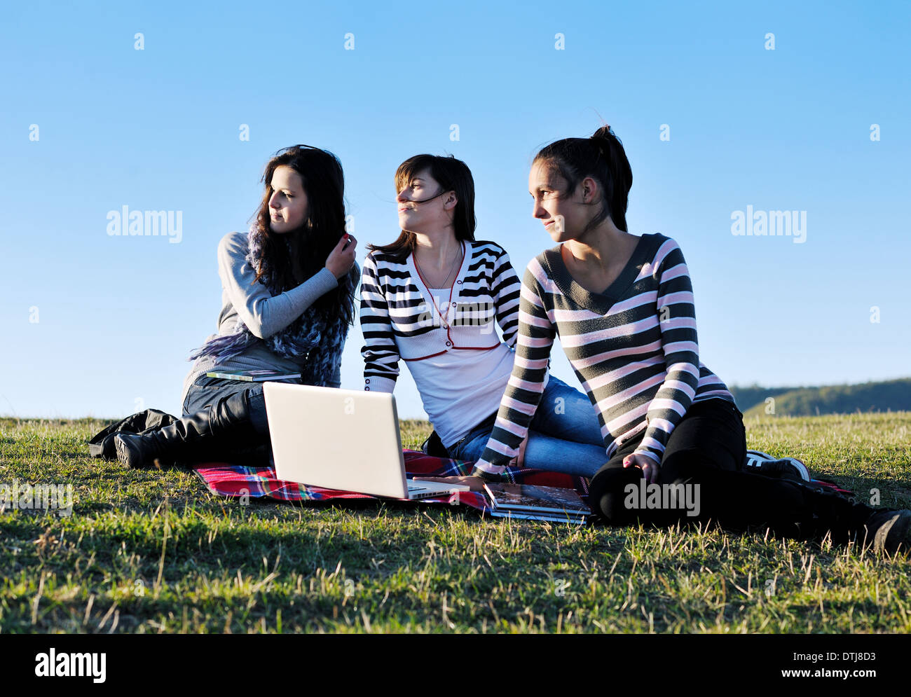group of teens working on laptop outdoor Stock Photo - Alamy