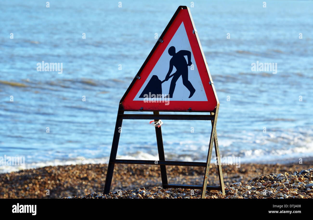 Men at Work - on the Beach Stock Photo - Alamy