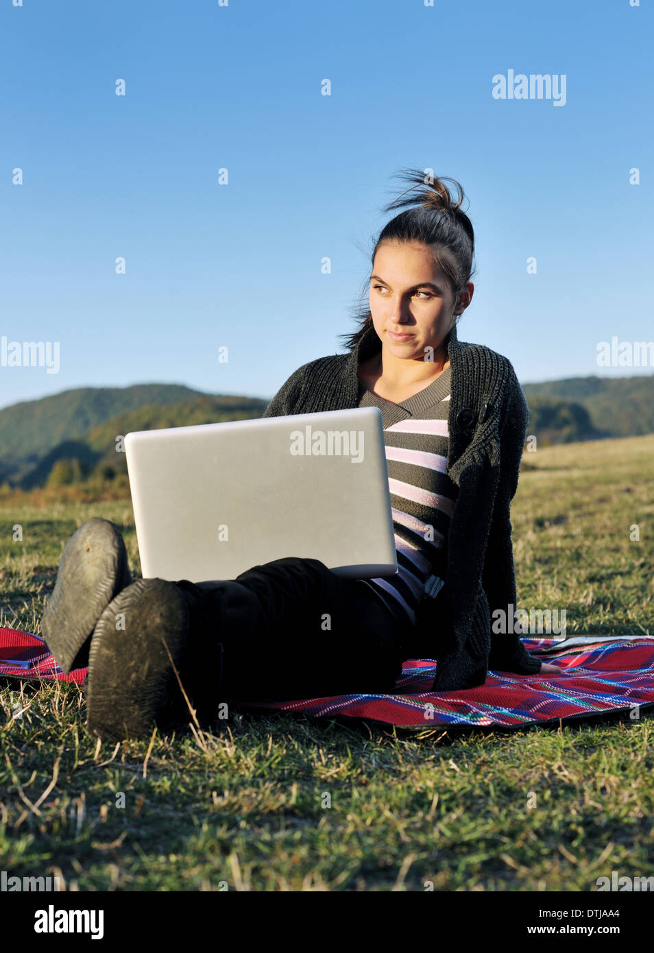 young teen girl work on laptop outdoor Stock Photo - Alamy