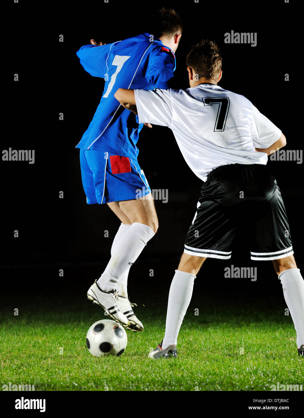 football players in action for the ball Stock Photo - Alamy
