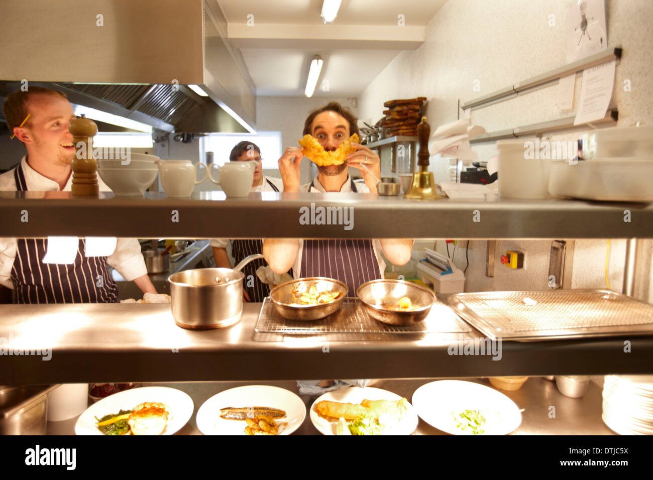 CHEFS HAVING SOME FUN IN THE KITCHEN Stock Photo - Alamy