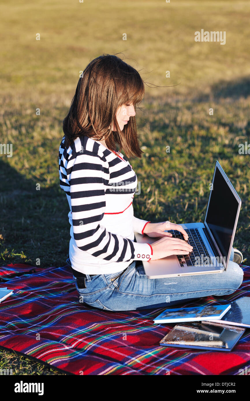 young teen girl work on laptop outdoor Stock Photo - Alamy