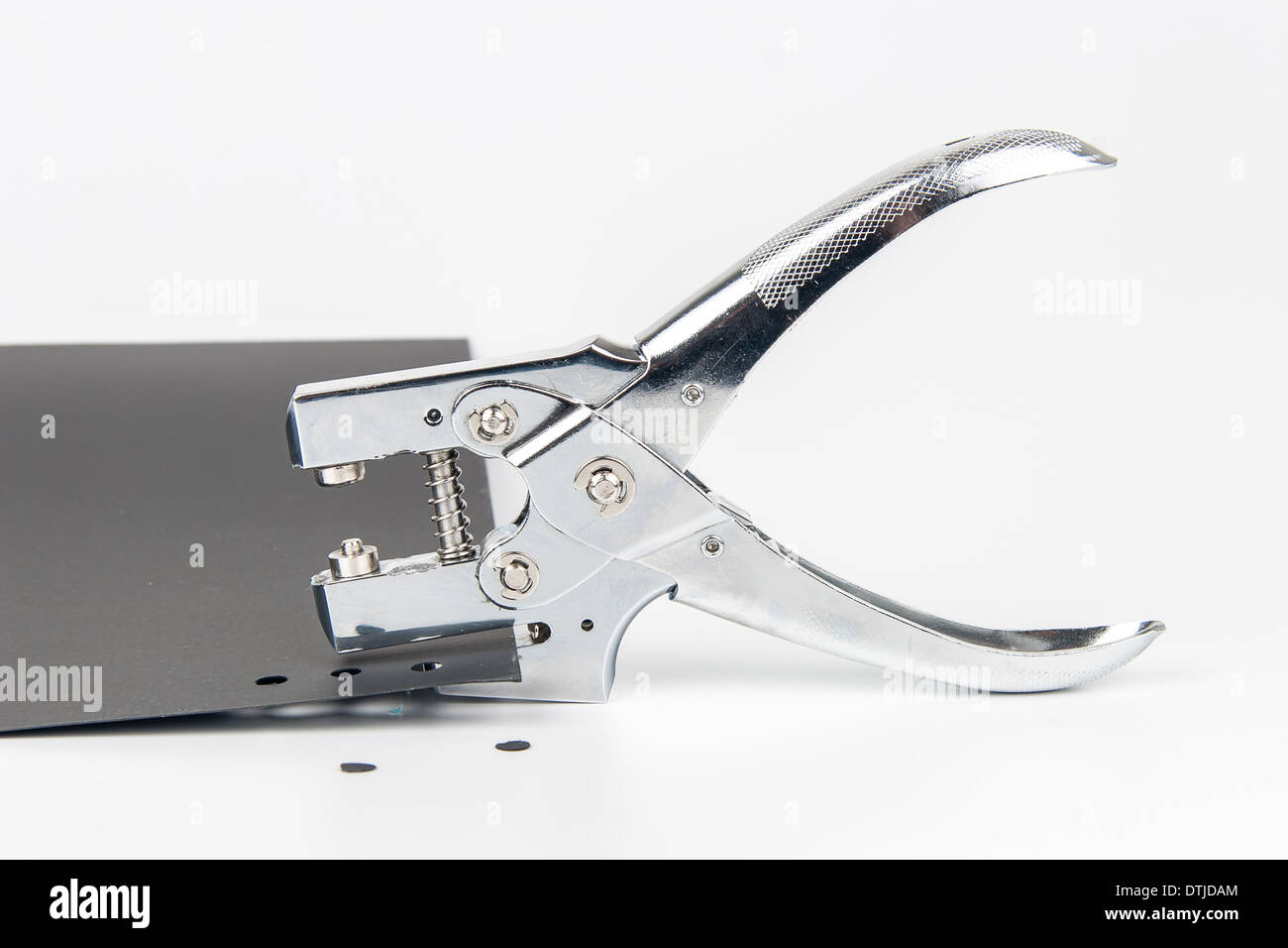 Office Puncher Unit isolated on white background Stock Photo - Alamy