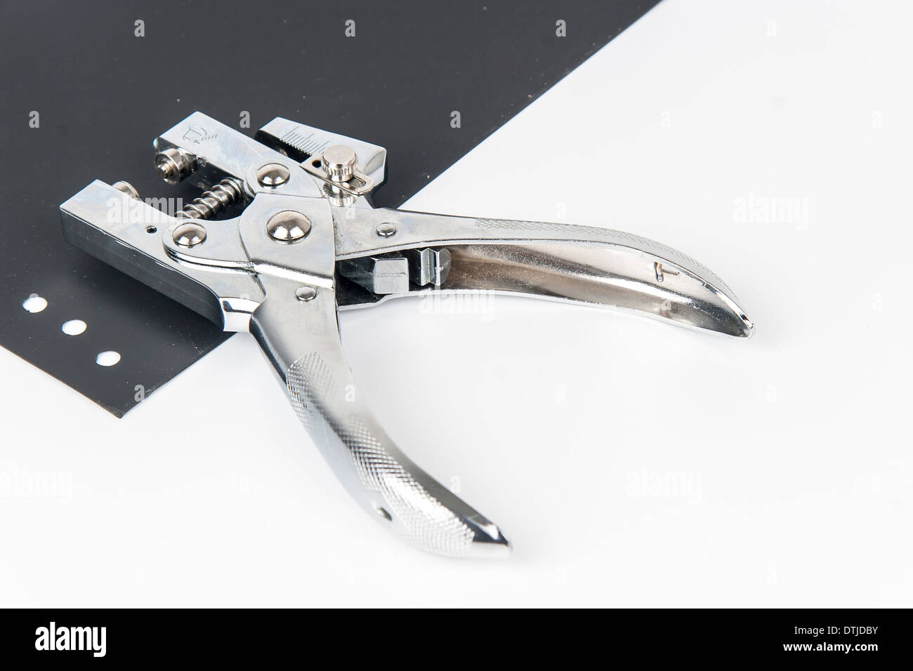 Office Puncher Unit isolated on white background Stock Photo - Alamy