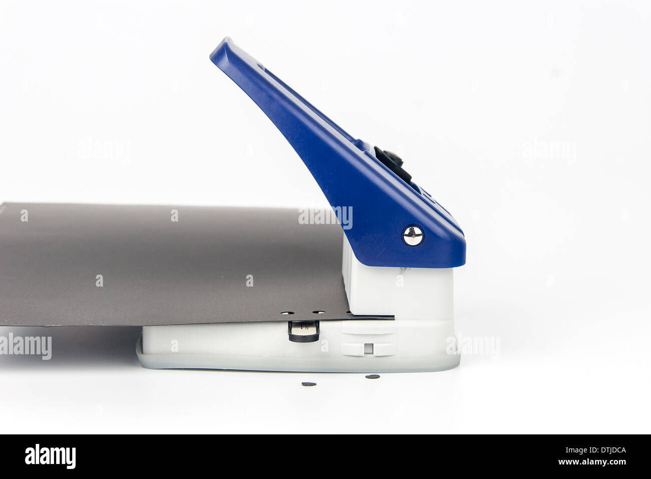 Office Puncher Unit isolated on white background Stock Photo - Alamy