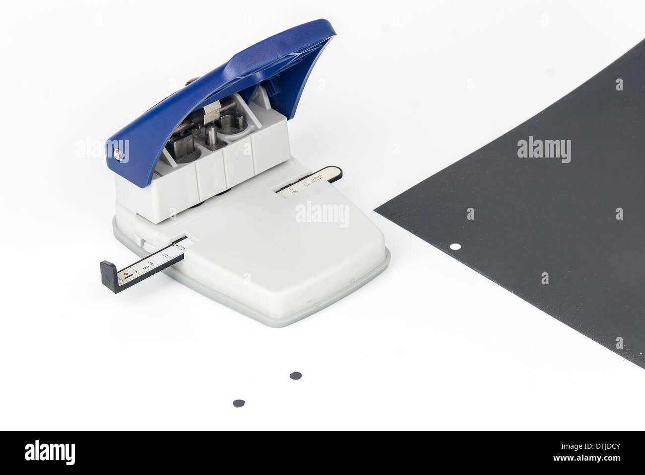 Office Puncher Unit isolated on white background Stock Photo - Alamy