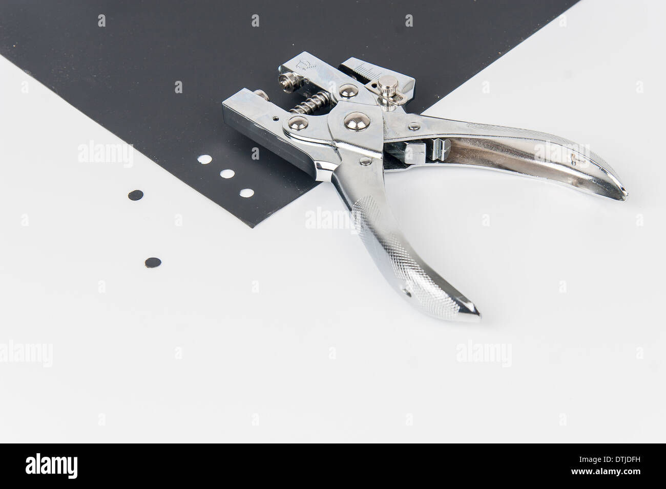 Office Puncher Unit isolated on white background Stock Photo - Alamy