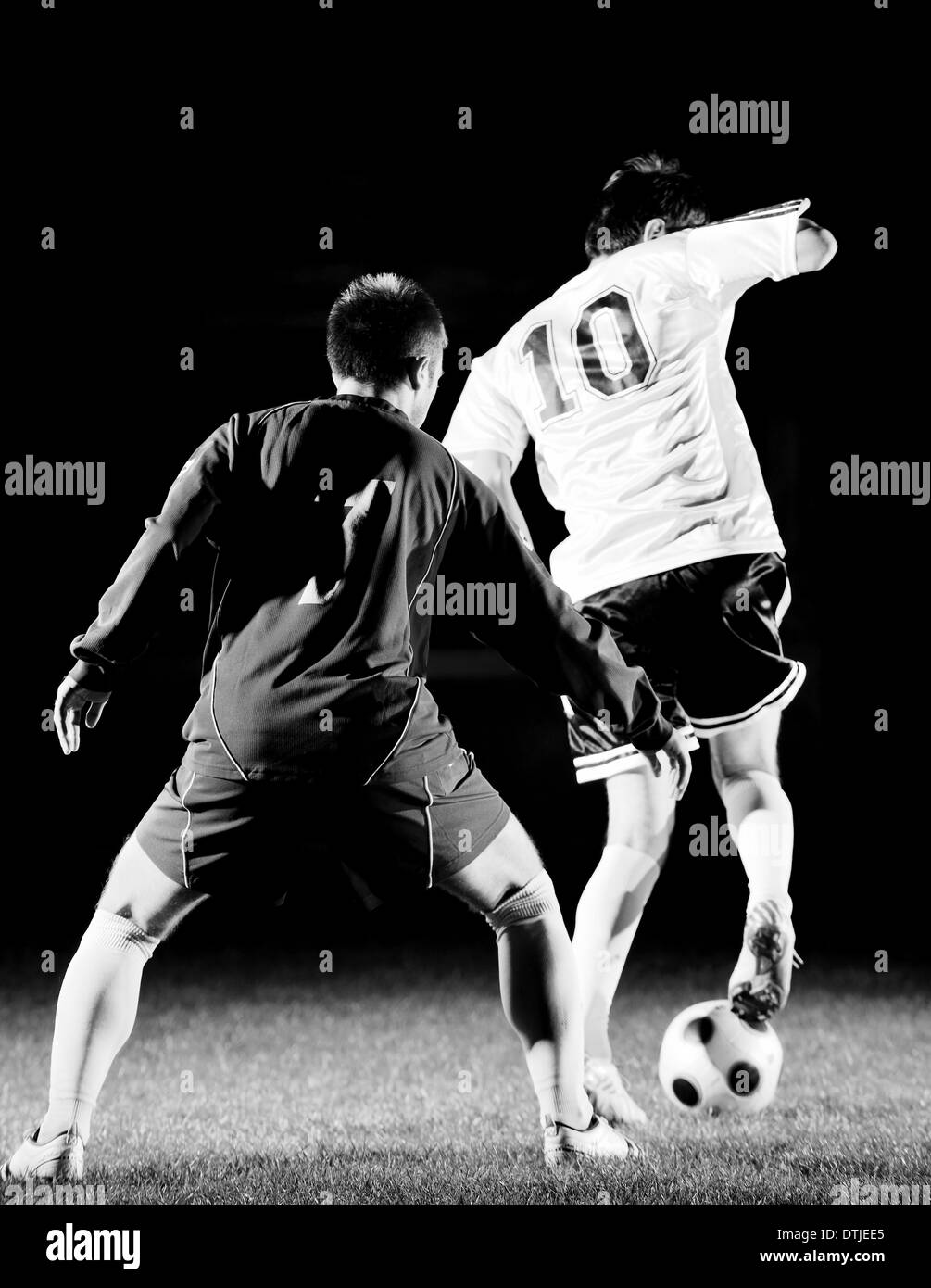 football players in action for the ball Stock Photo - Alamy