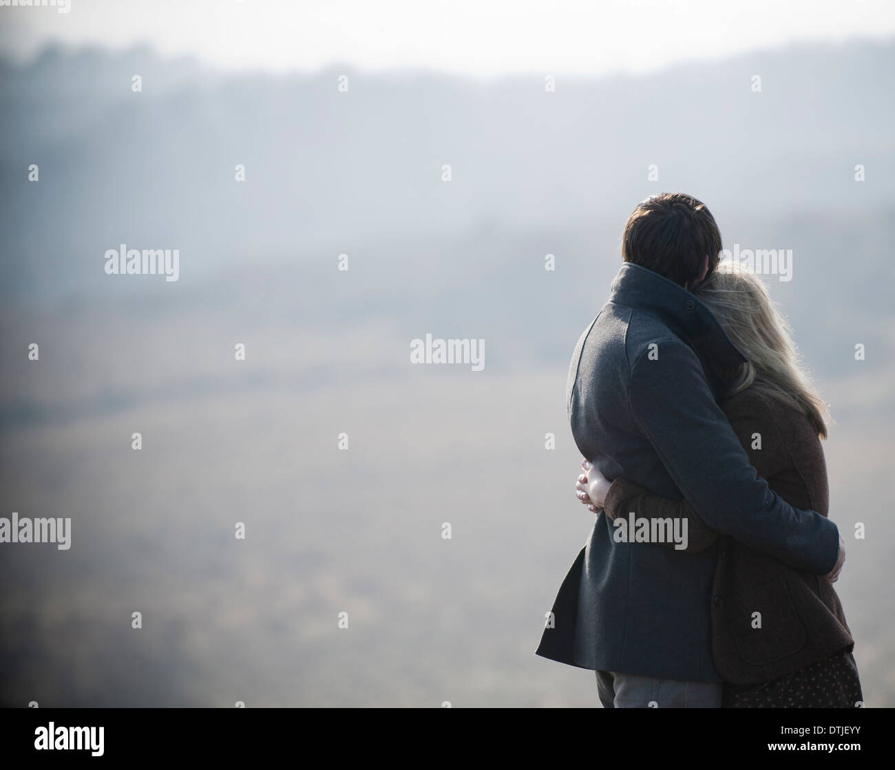 Couple mans arm around shoulder hi-res stock photography and images - Alamy