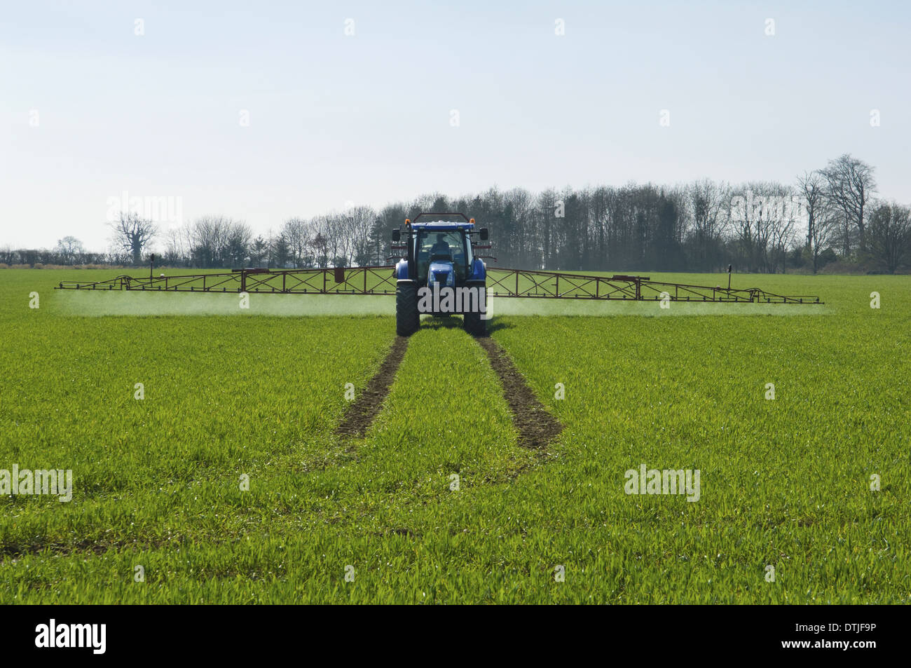 Tractor and crop-sprayer in field Gloucestershire England Stock Photo ...