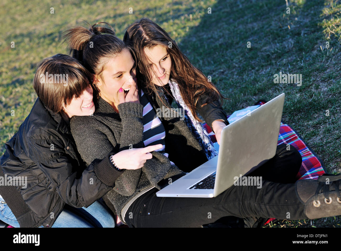 group of teens working on laptop outdoor Stock Photo - Alamy