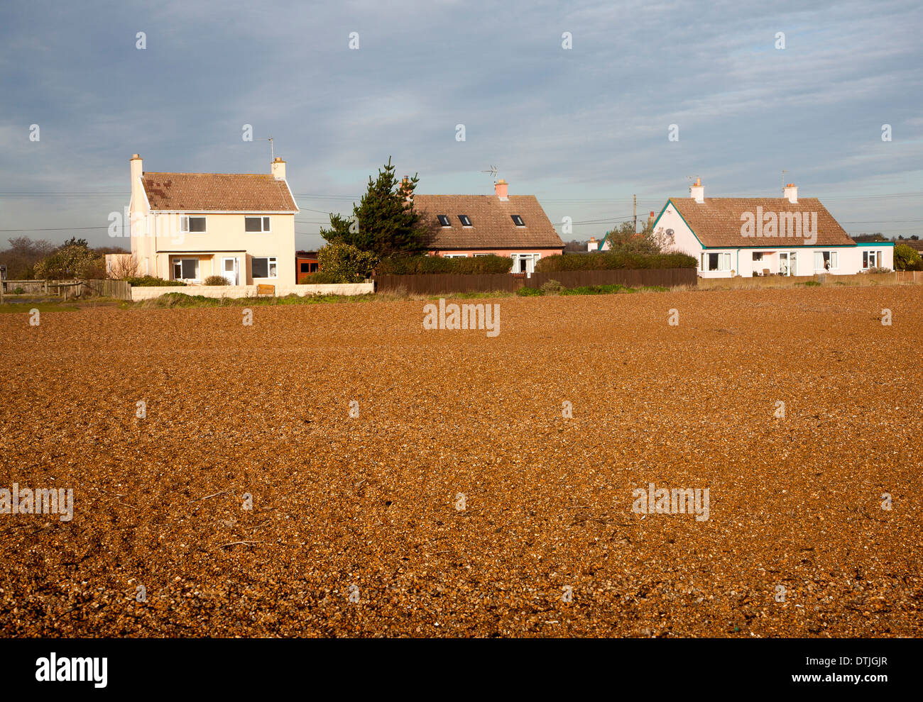 Houses in he coastal hamlet of Shingle Street seen from the beach ...