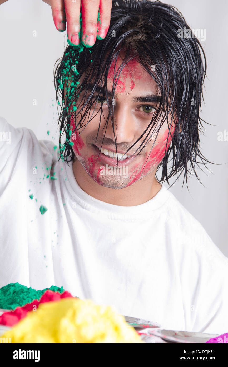 man holding plate of holi colour Stock Photo - Alamy