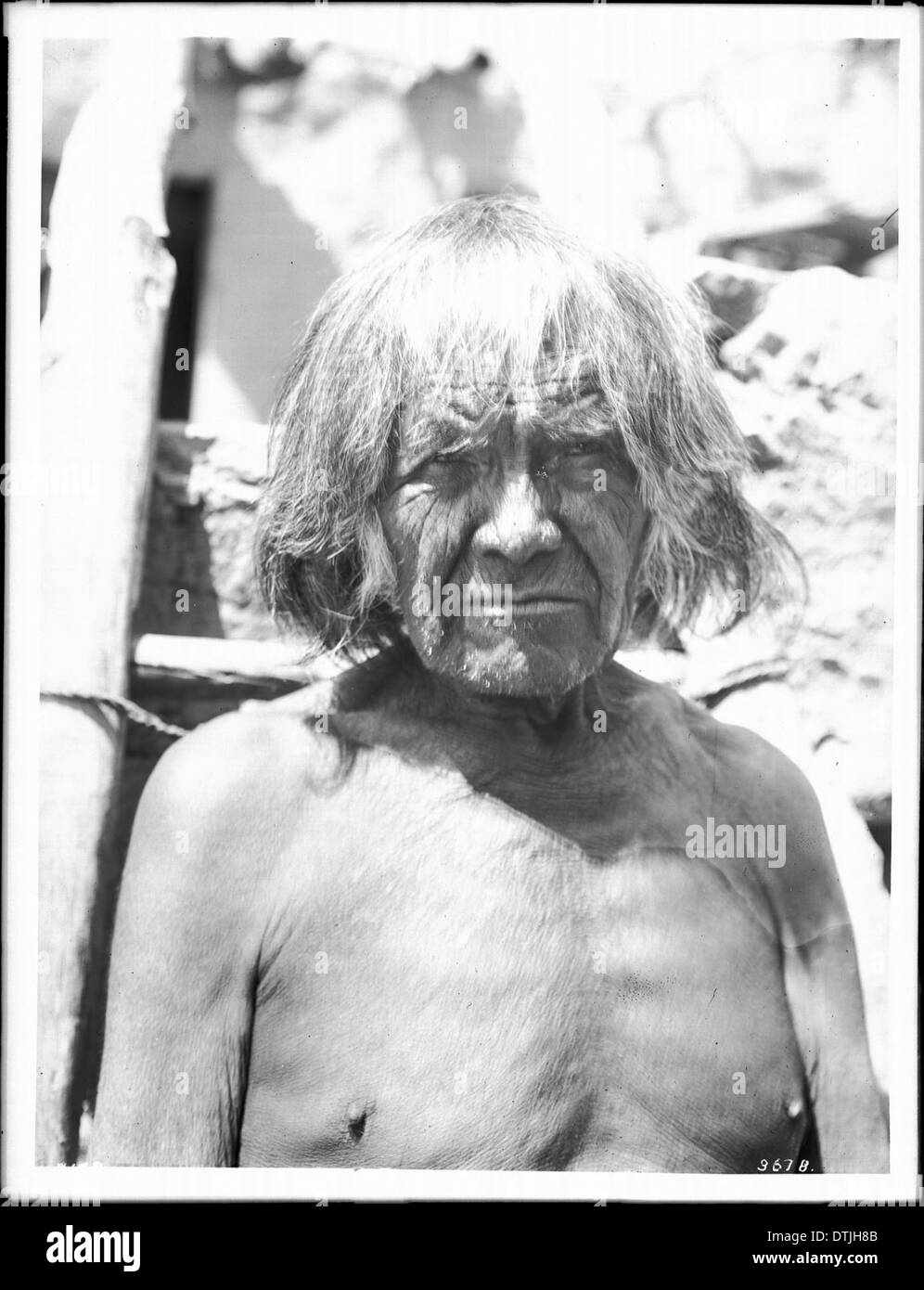 Old Hopi Indian man standing outside, barechested, ca.1900 Stock Photo ...