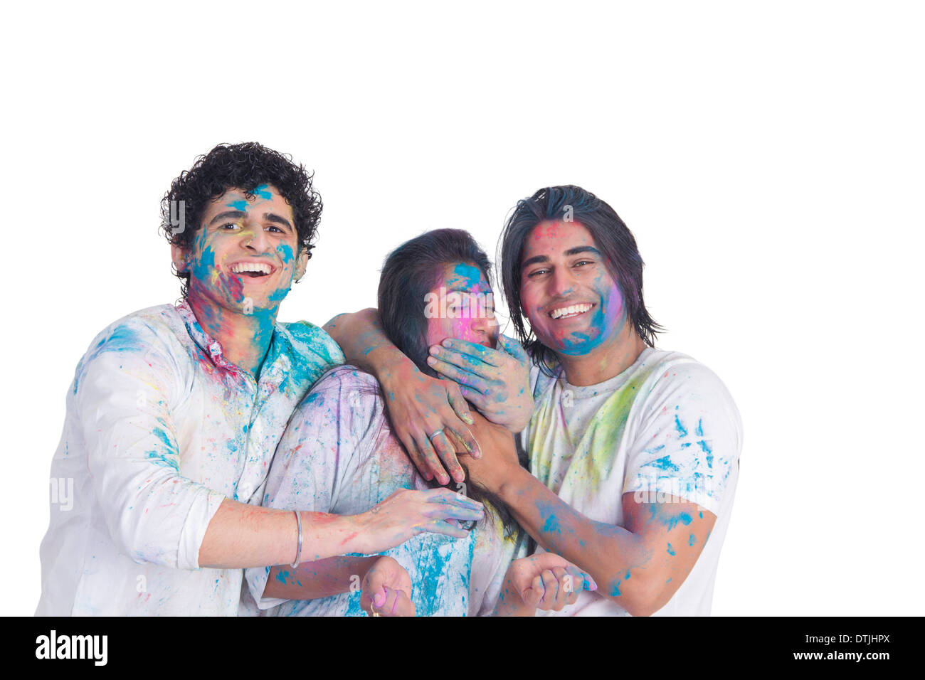 Portrait three friends playing holi hi-res stock photography and images ...