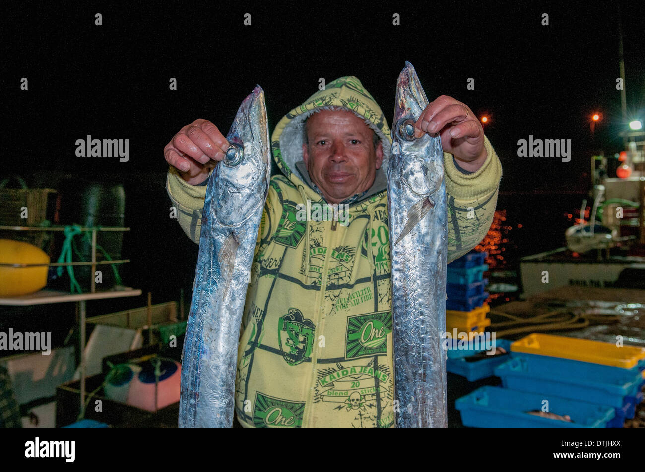 Fisherman holds Silver scabbardfish (Lepidopus caudatus). San Miguel ...