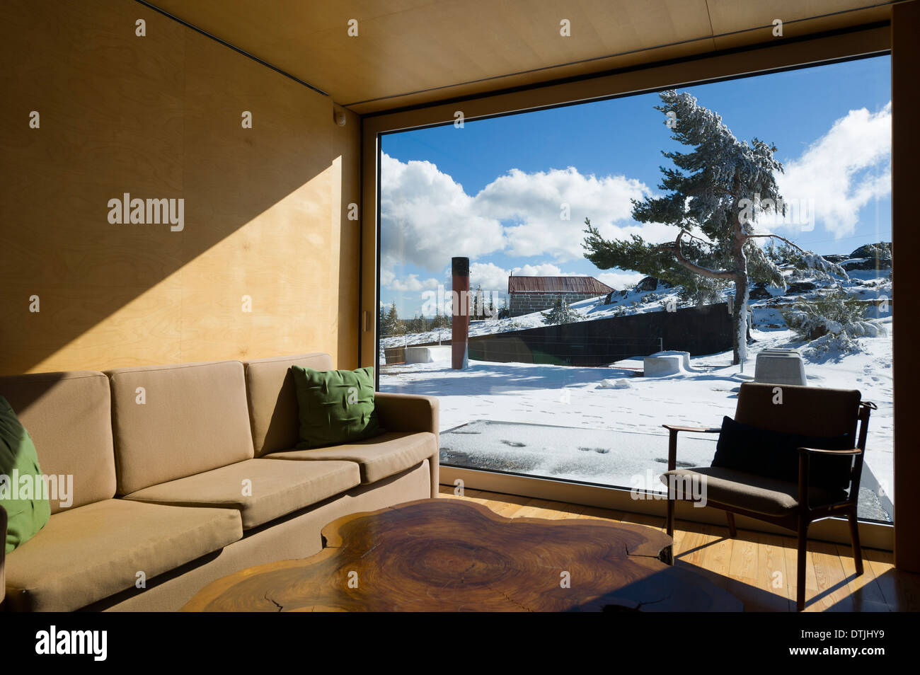 Living room with large window with a view to a snowy landscape Stock ...