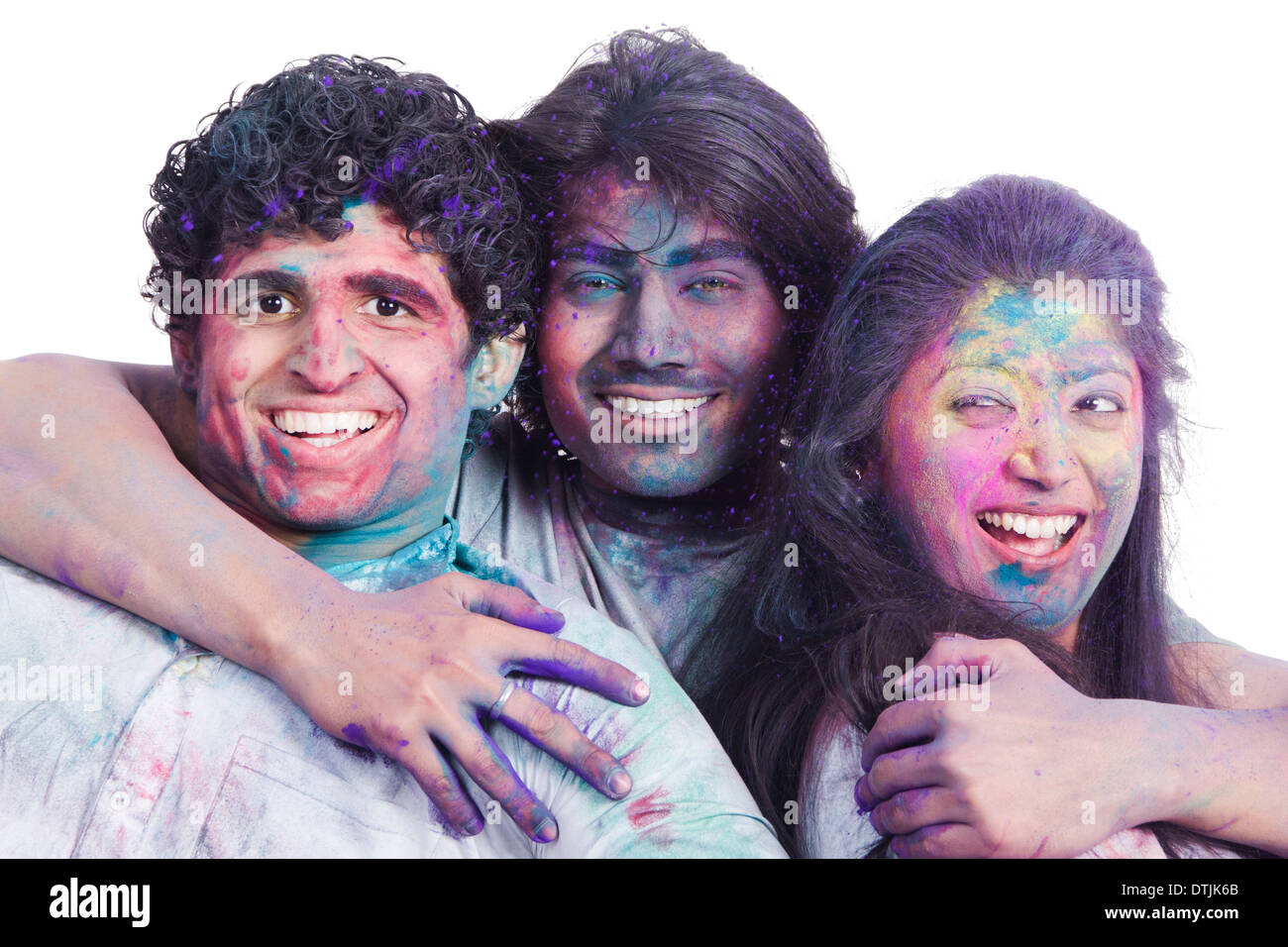 Portrait three friends playing holi hi-res stock photography and images ...