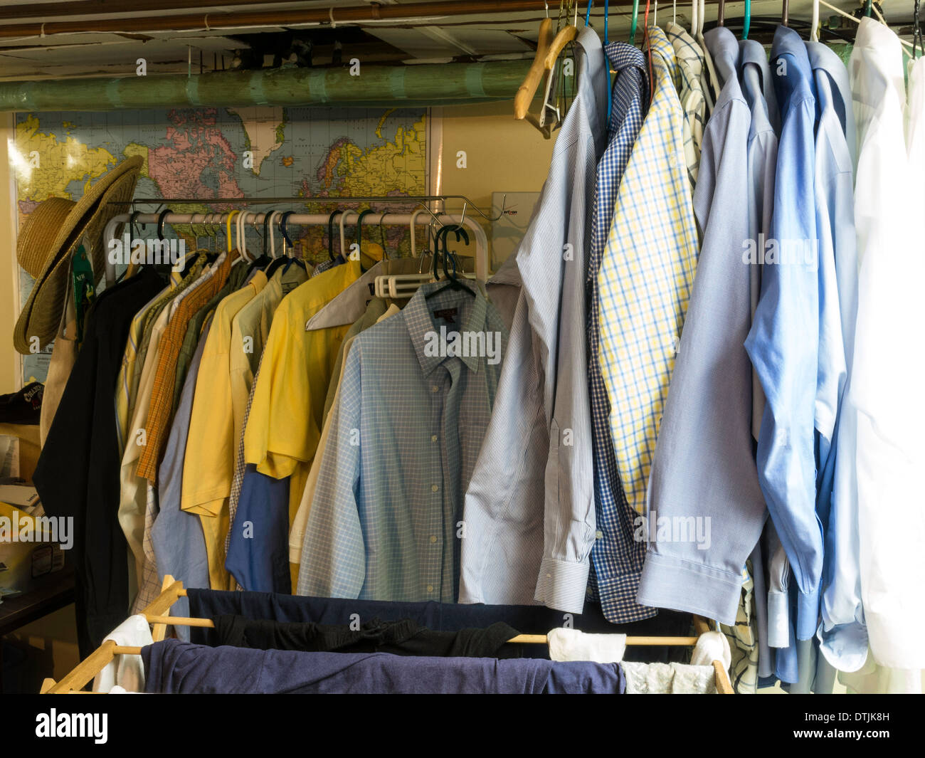 Clean Clothes Hanging in a Residential Laundry Room Stock Photo - Alamy