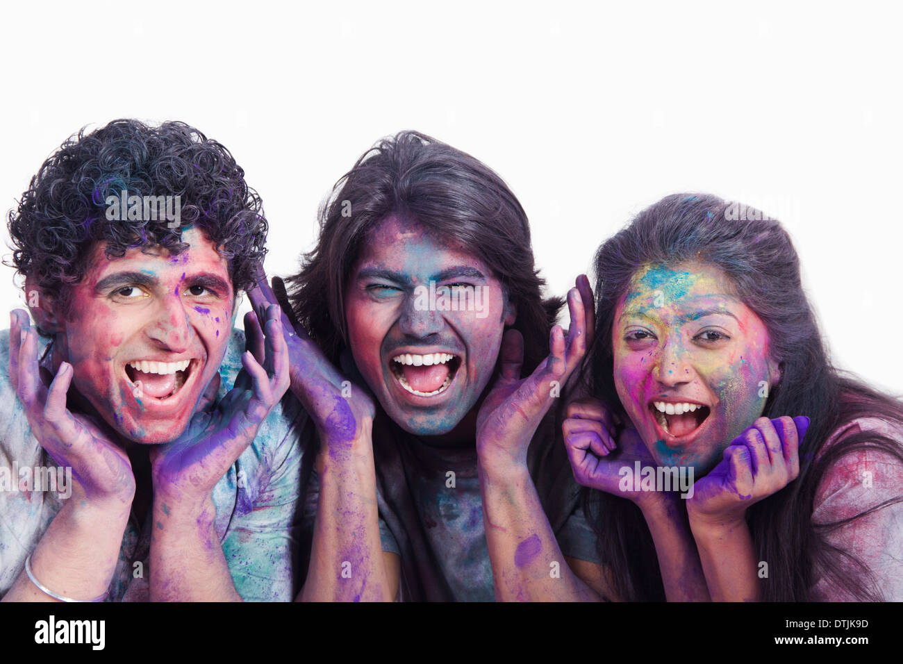 Portrait three friends playing holi hi-res stock photography and images ...