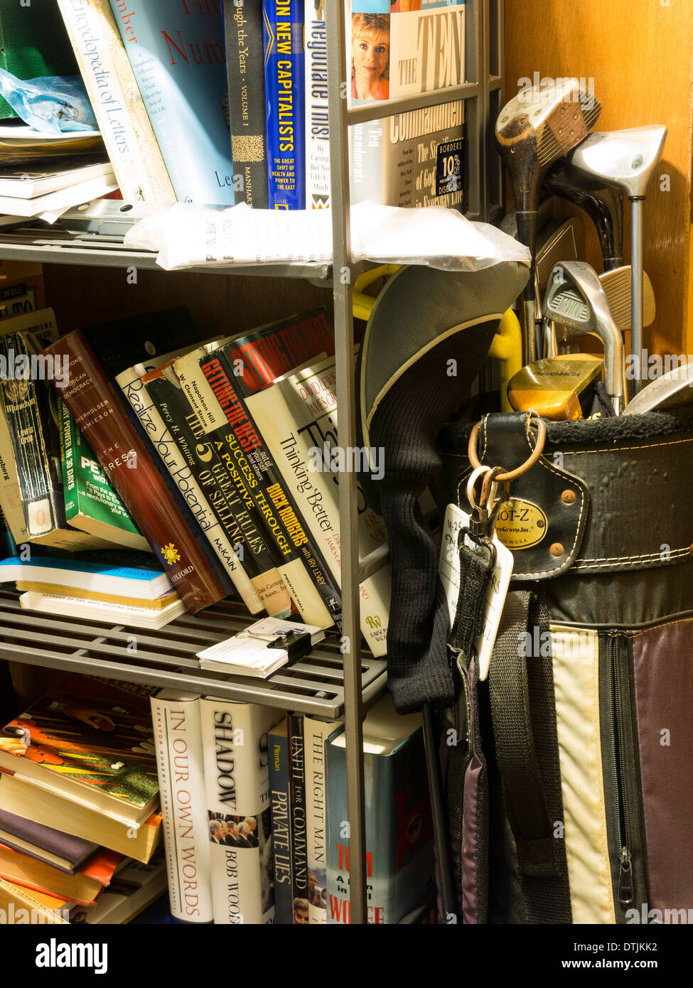 Hoarders' Messy Bookcase and Golf Clubs, Home Storage Room, USA Stock ...