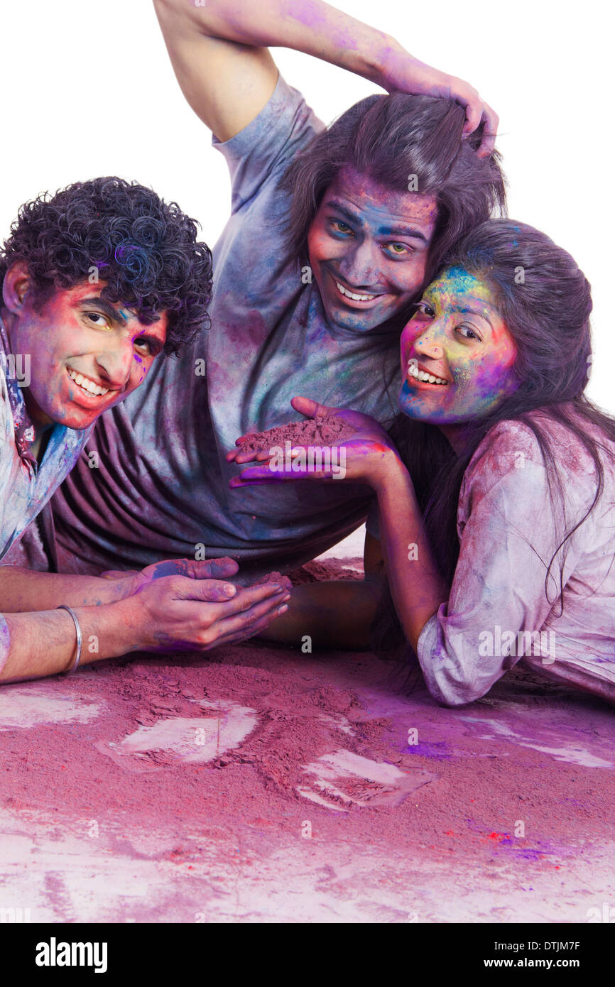 Portrait three friends playing holi hi-res stock photography and images ...