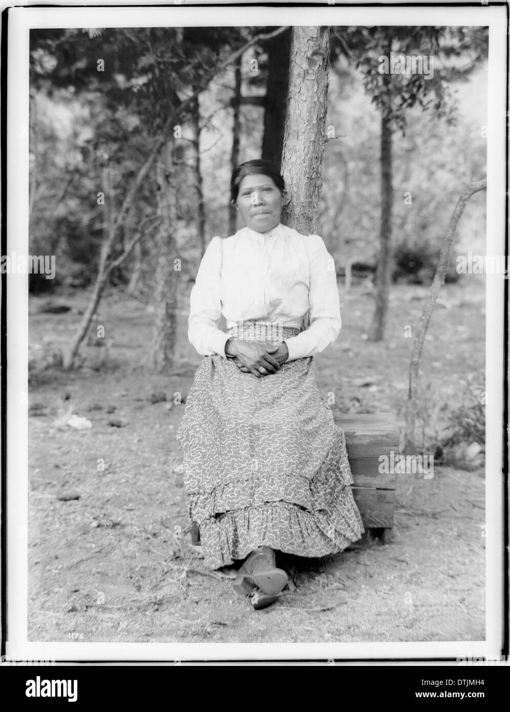 A Paiute Indian woman is pictured sitting on a small wooden crate in ...