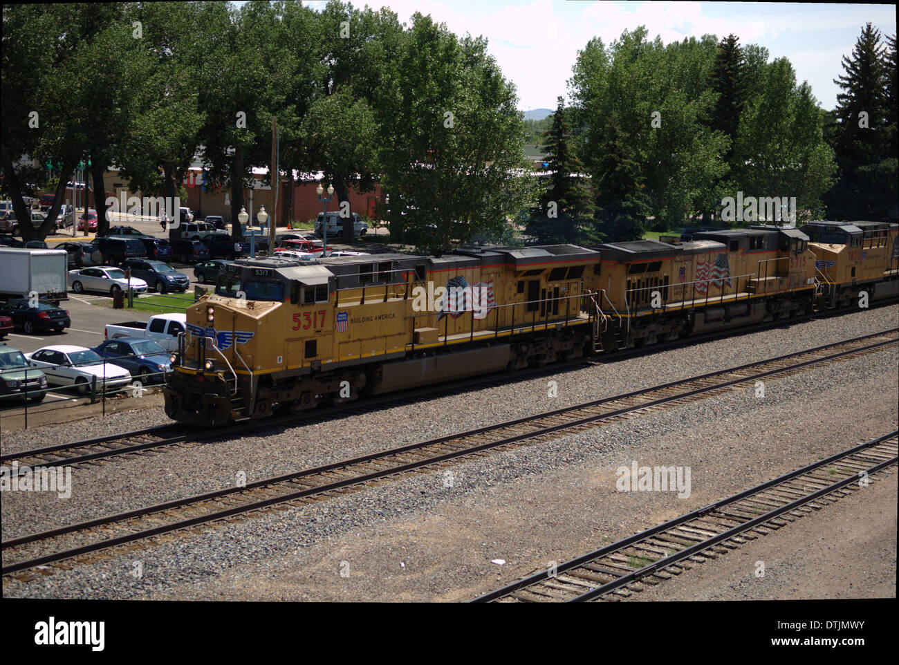 Freight train passing through Laramie, Wyoming Stock Photo - Alamy