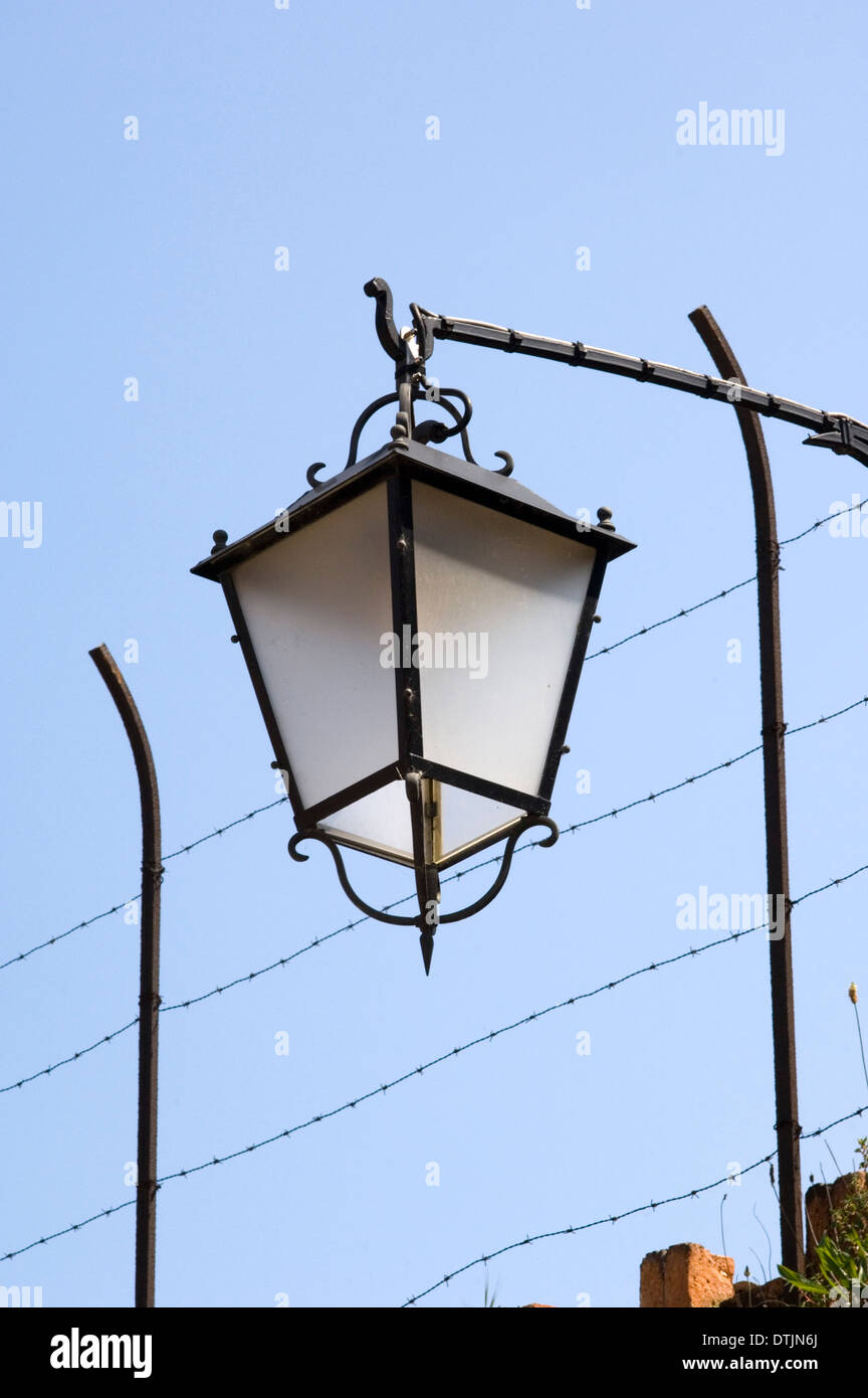Old fashioned street lantern and barbed wire, detail Stock Photo - Alamy
