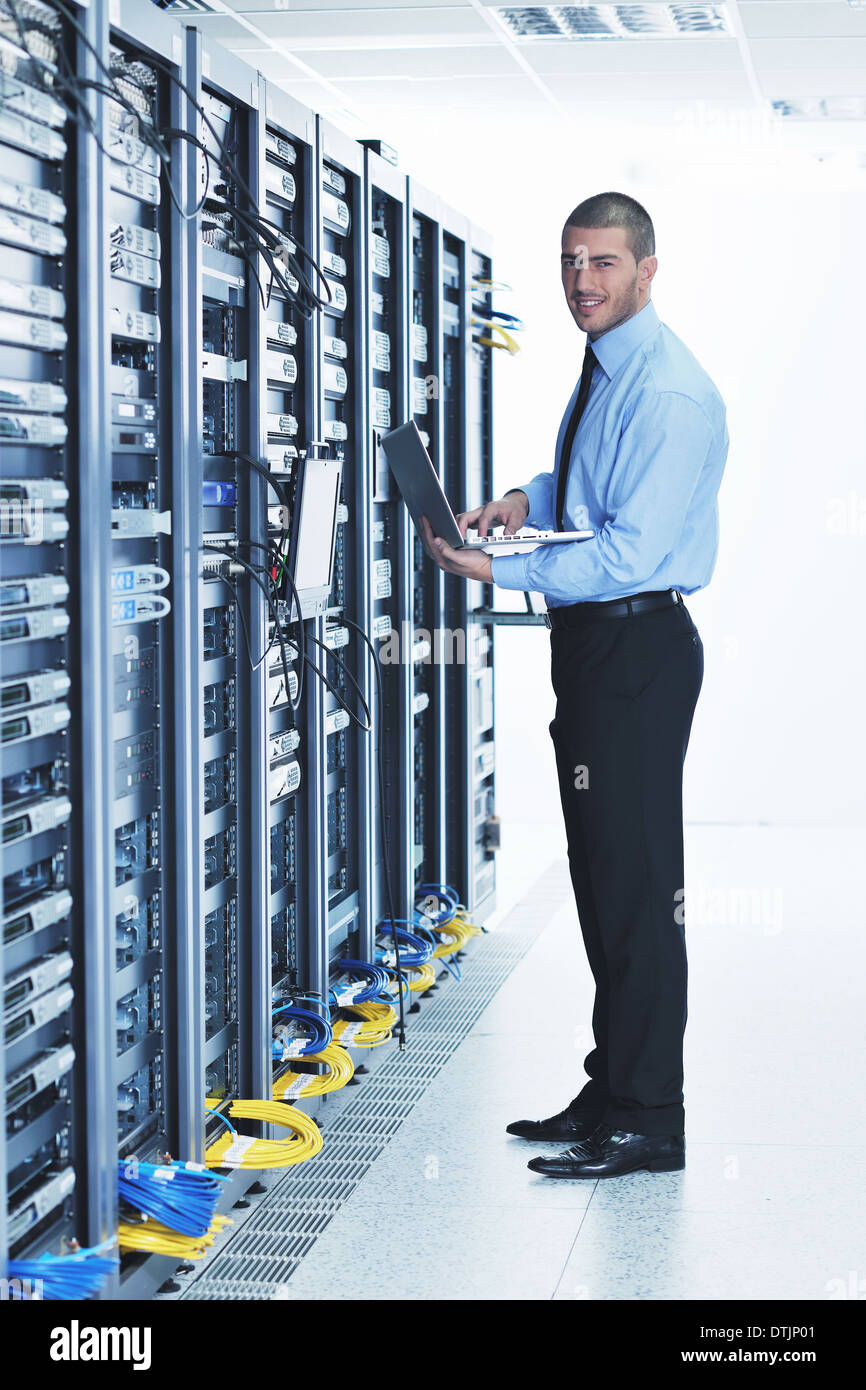 businessman with laptop in network server room Stock Photo - Alamy