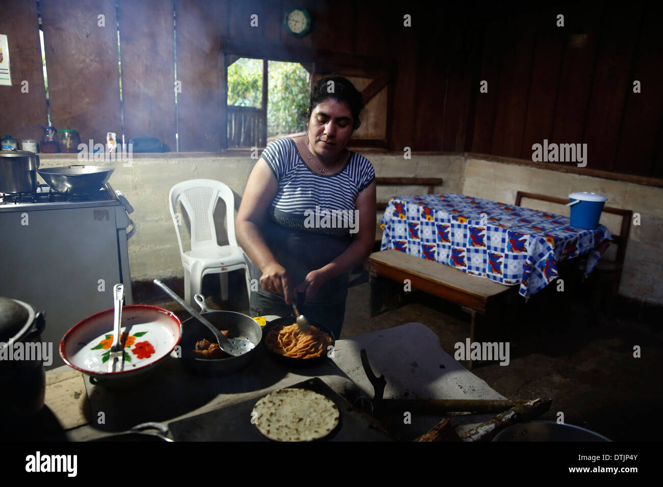 Poor woman cooking hi-res stock photography and images - Alamy