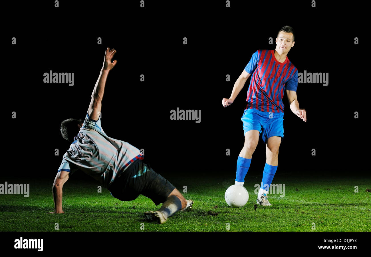football players in competition for the ball Stock Photo - Alamy