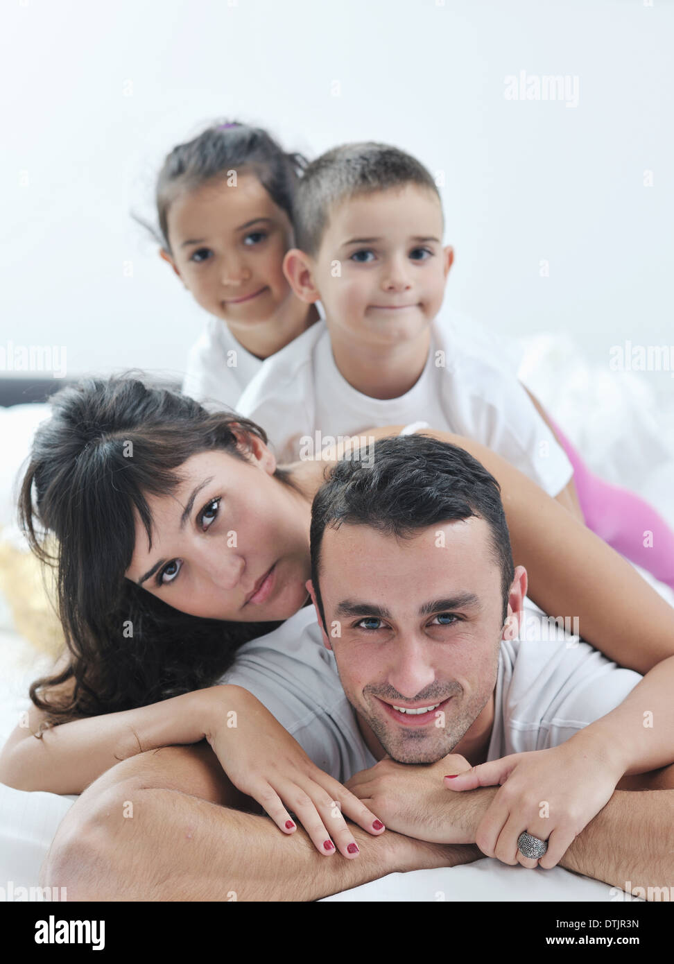 happy young Family in their bedroom Stock Photo - Alamy
