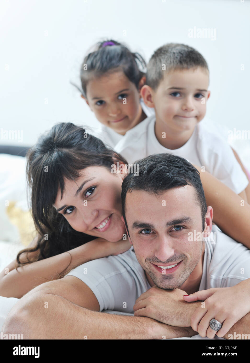 happy young Family in their bedroom Stock Photo - Alamy