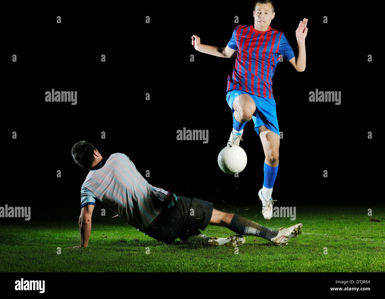 football players in competition for the ball Stock Photo - Alamy