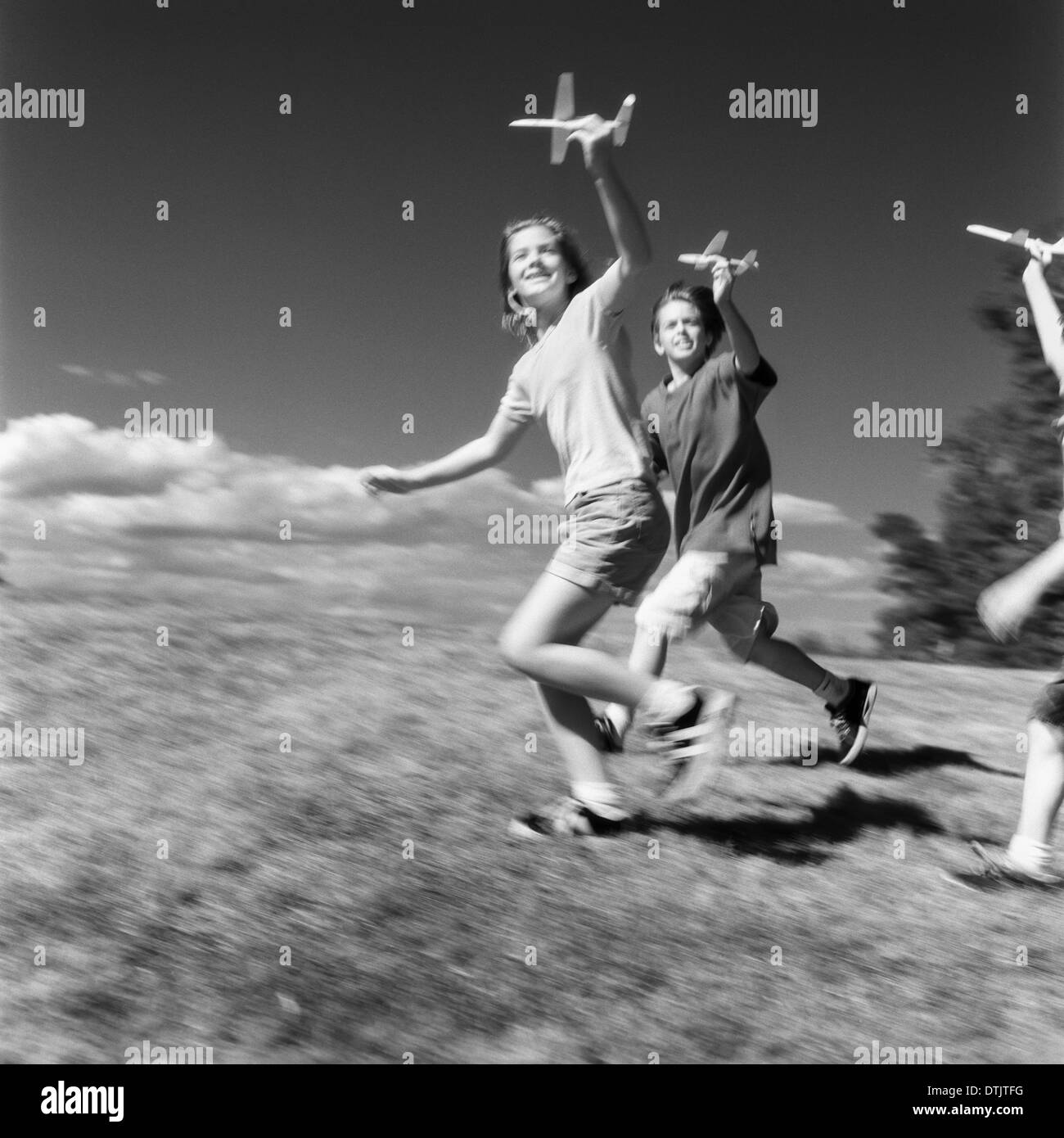 Children running with paper airplanes on the Grand Allee at Castle Hill ...