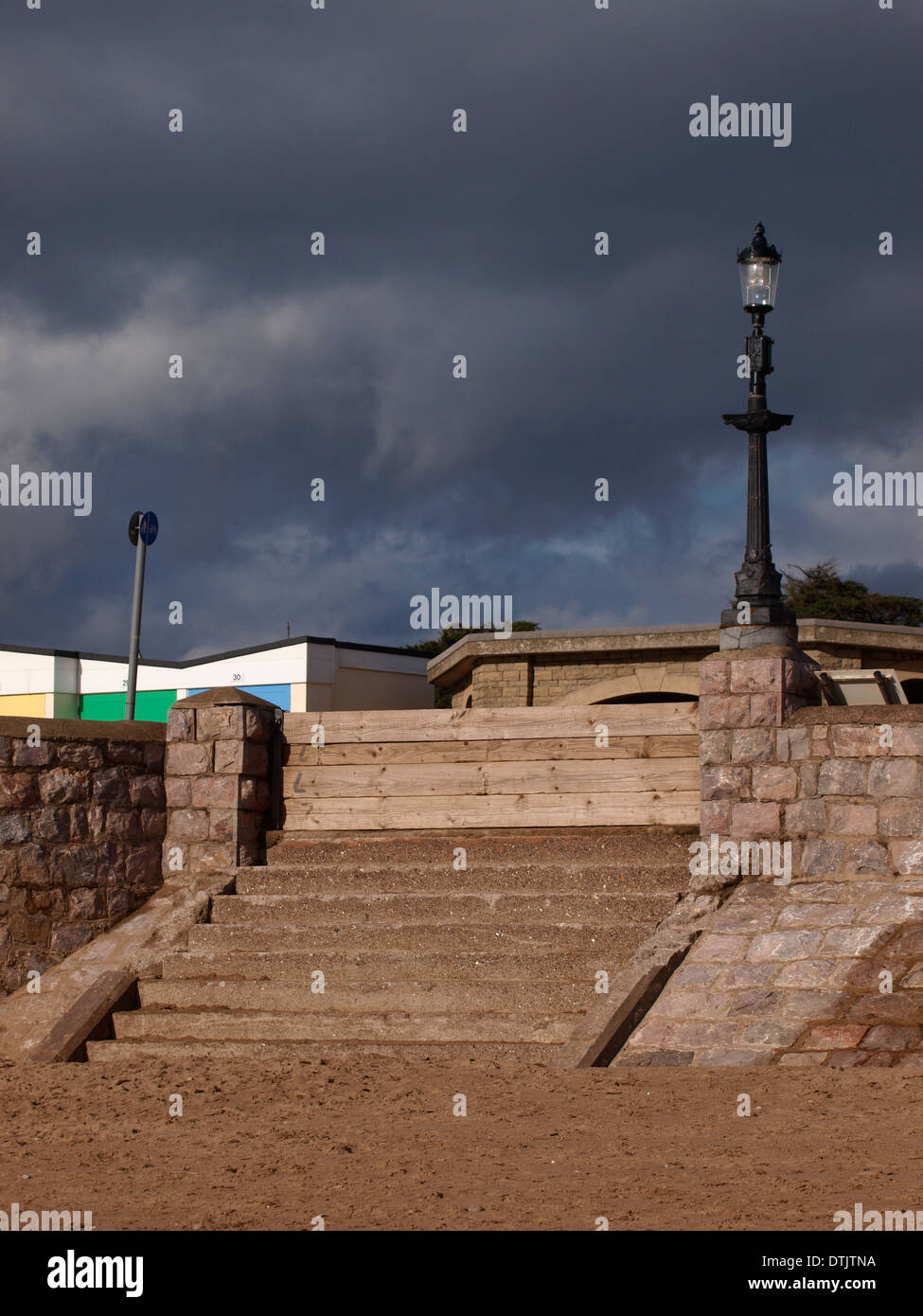 Wooden barriers blocking the steps along the seawall during bad weather ...