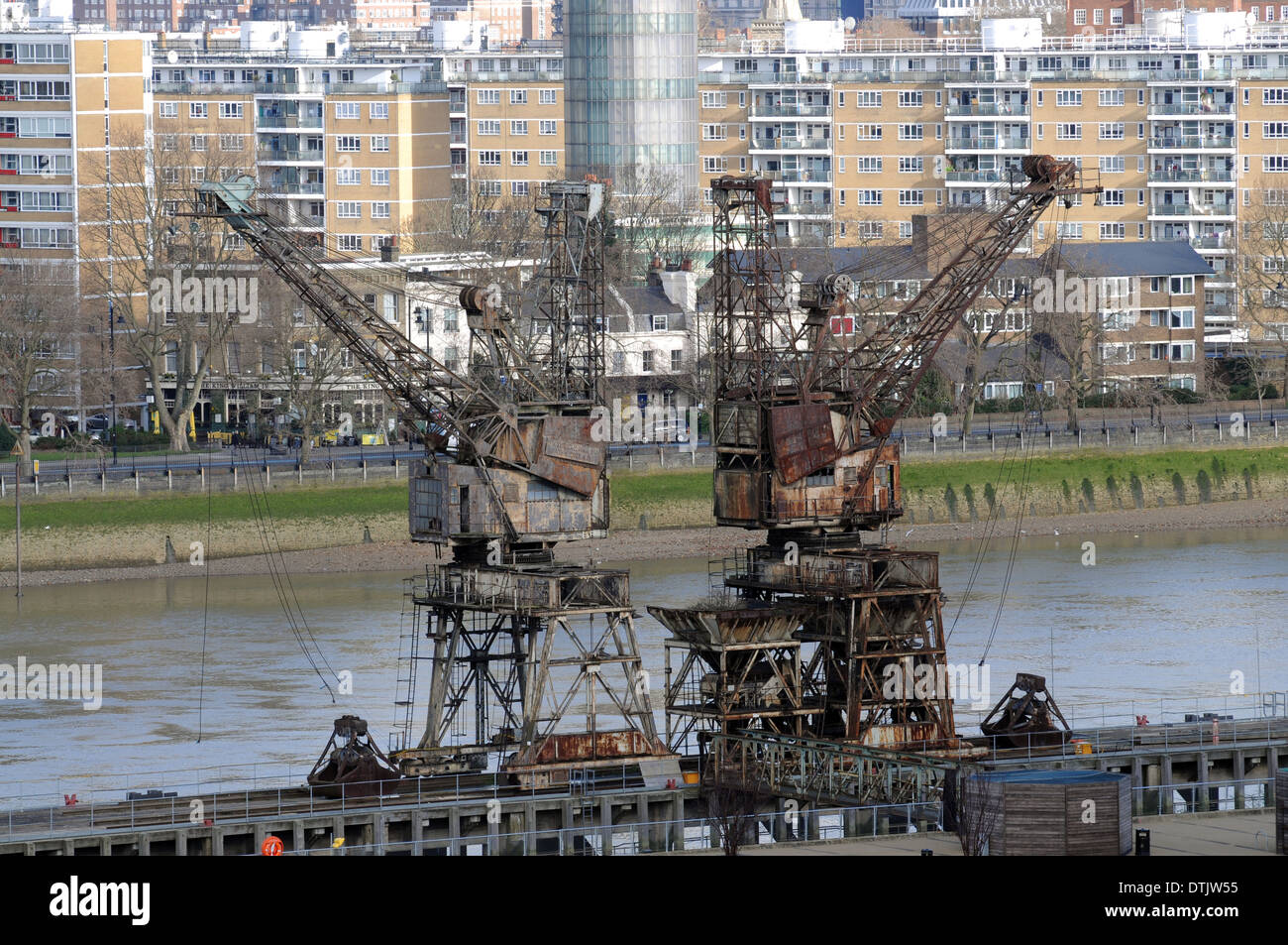 Old abandoned docking cranes outside Battersea Power Station in London ...