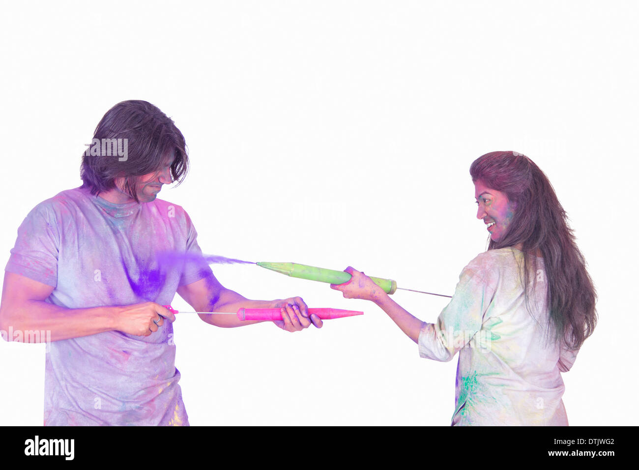 Couple playing on holi pichkari Cut Out Stock Images & Pictures - Alamy