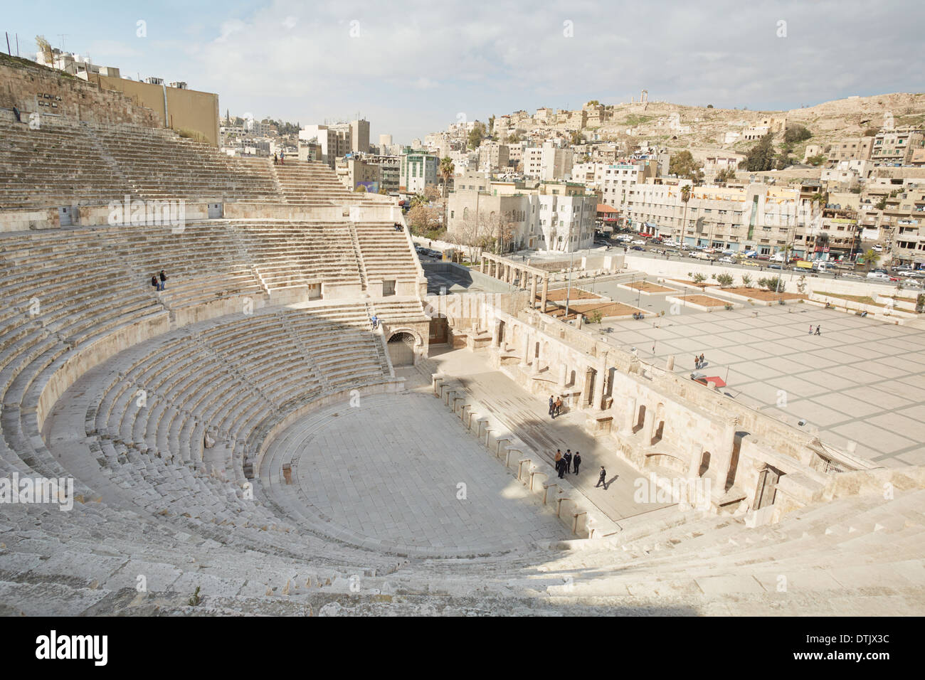 Ancient roman theater and city view with people in Amman, Jordan Stock ...