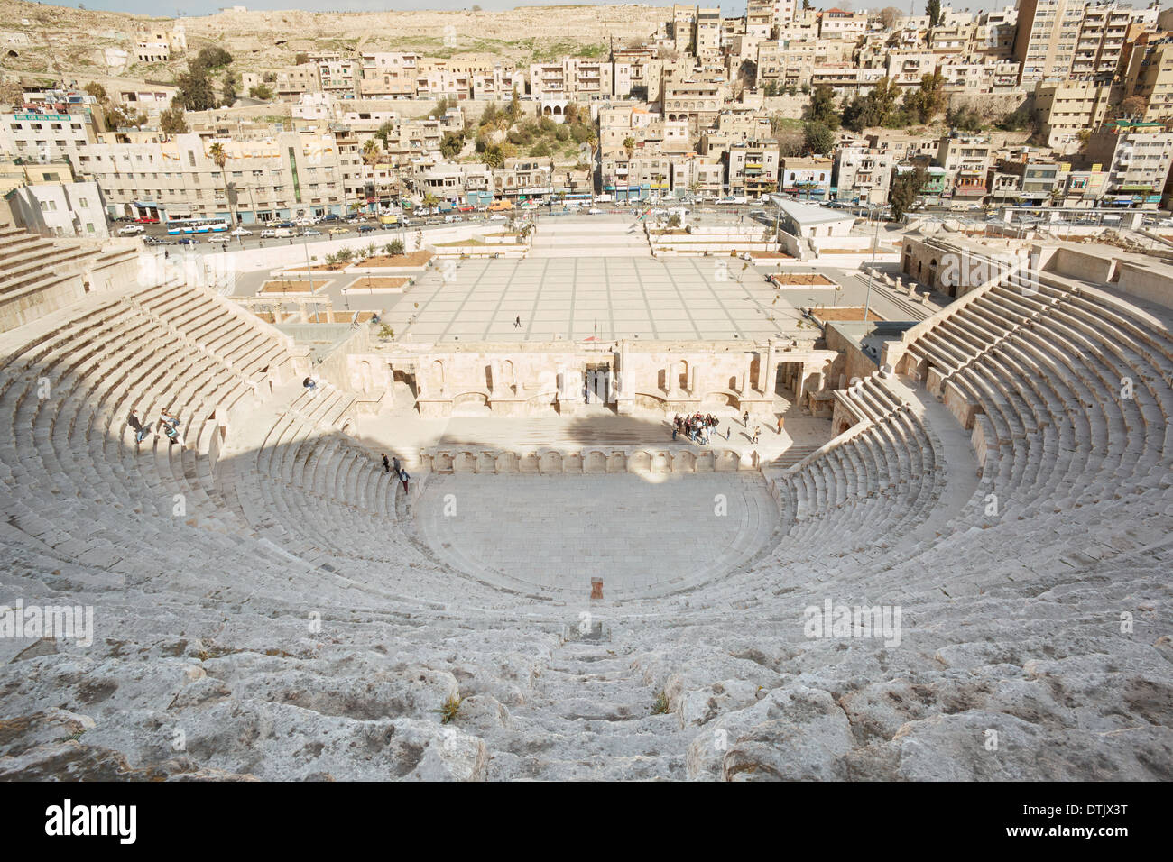 Ancient roman theater and city view with people in Amman, Jordan Stock ...