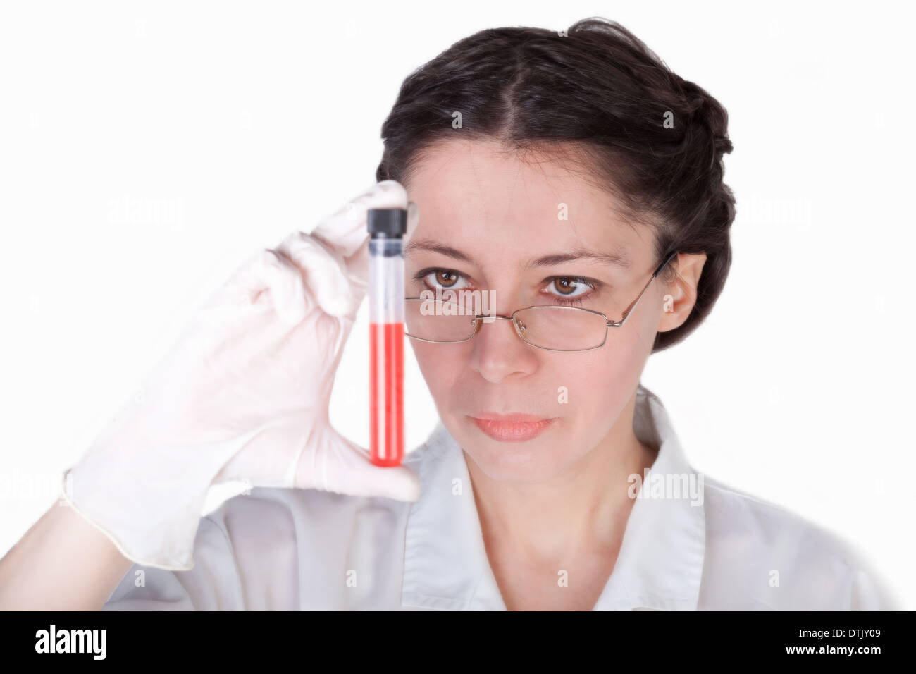 A scientist studying a test sample in a test tube isolated on white ...