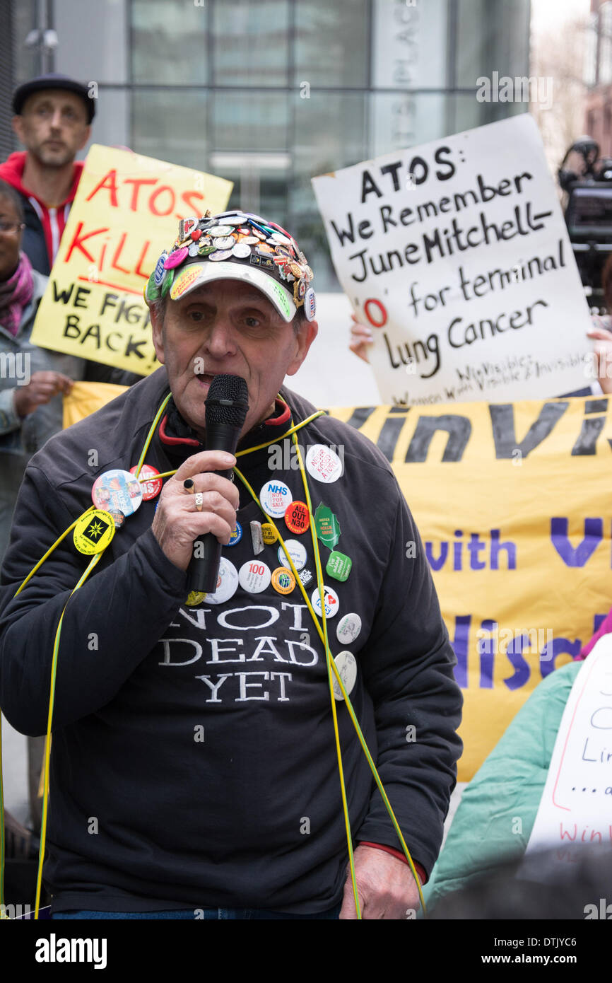 ATOS headquarters, London, UK, 19th February, 2014. A protester speaks ...