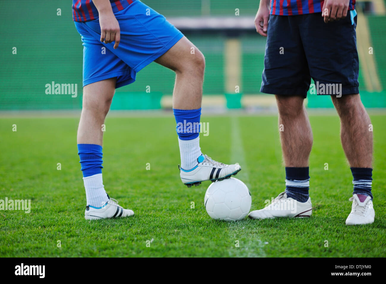 football players in competition for the ball Stock Photo - Alamy