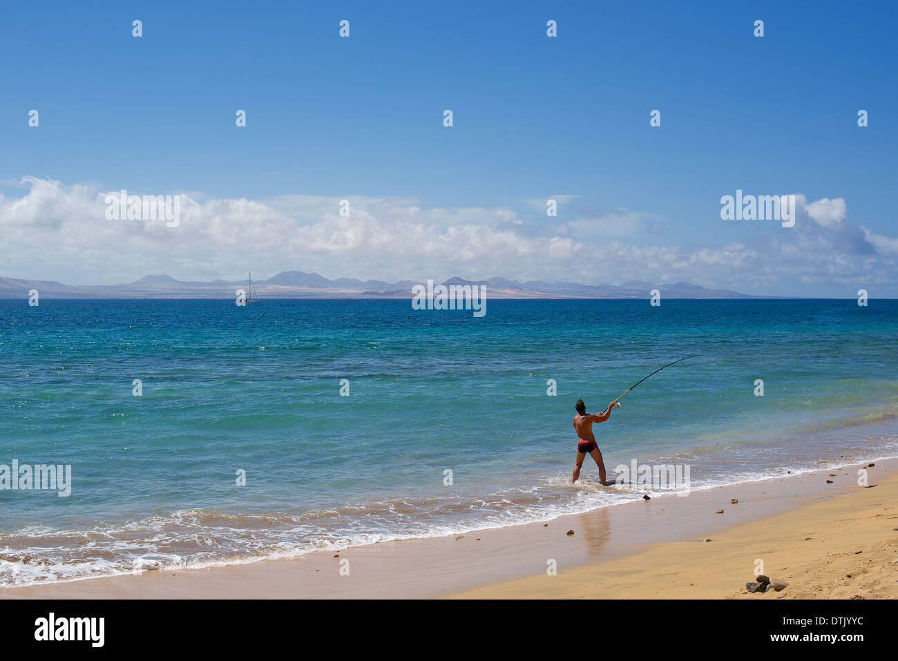 Angler angling fishing casting beach hi-res stock photography and ...