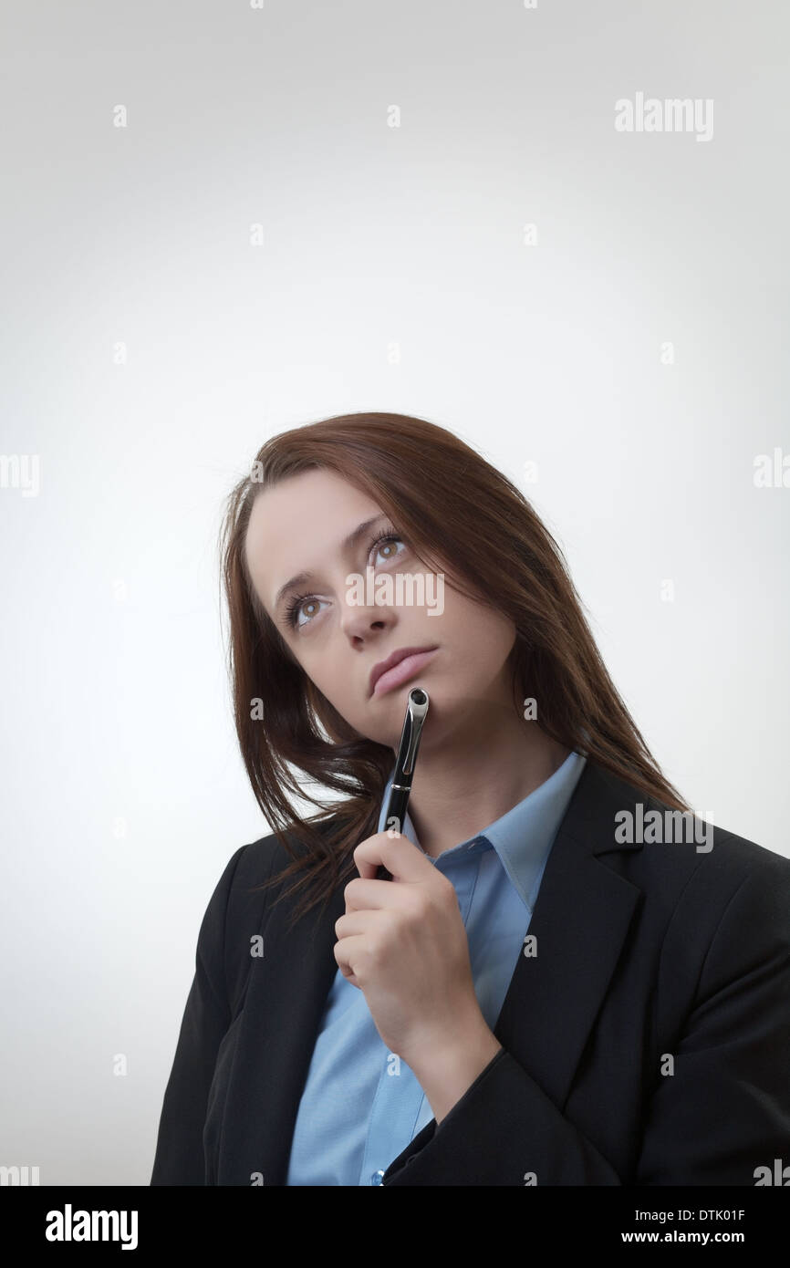 Thoughtful concentrated female employee hi-res stock photography and ...