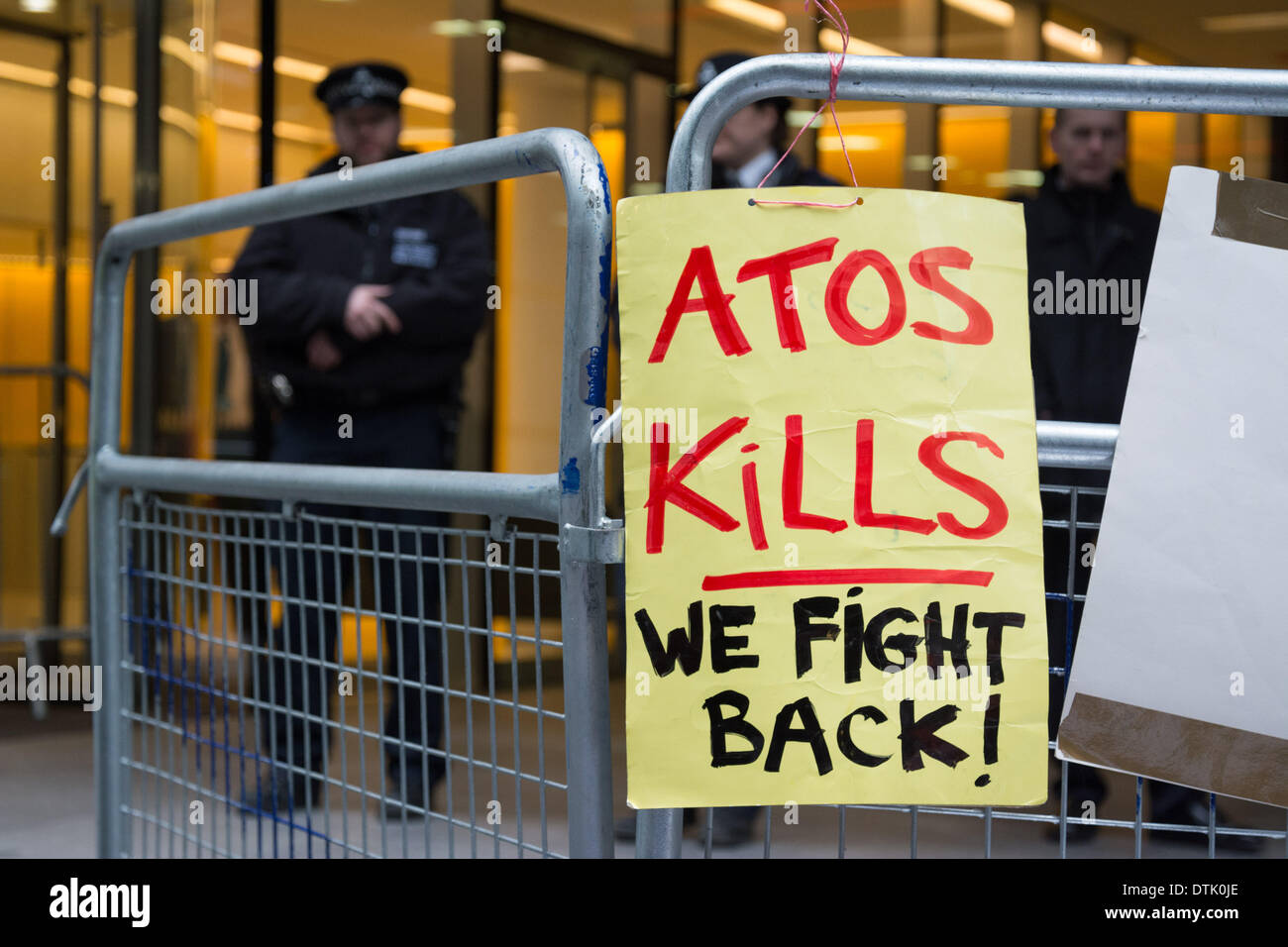 ATOS headquarters, London, UK, 19th February, 2014. A placard hangs on ...