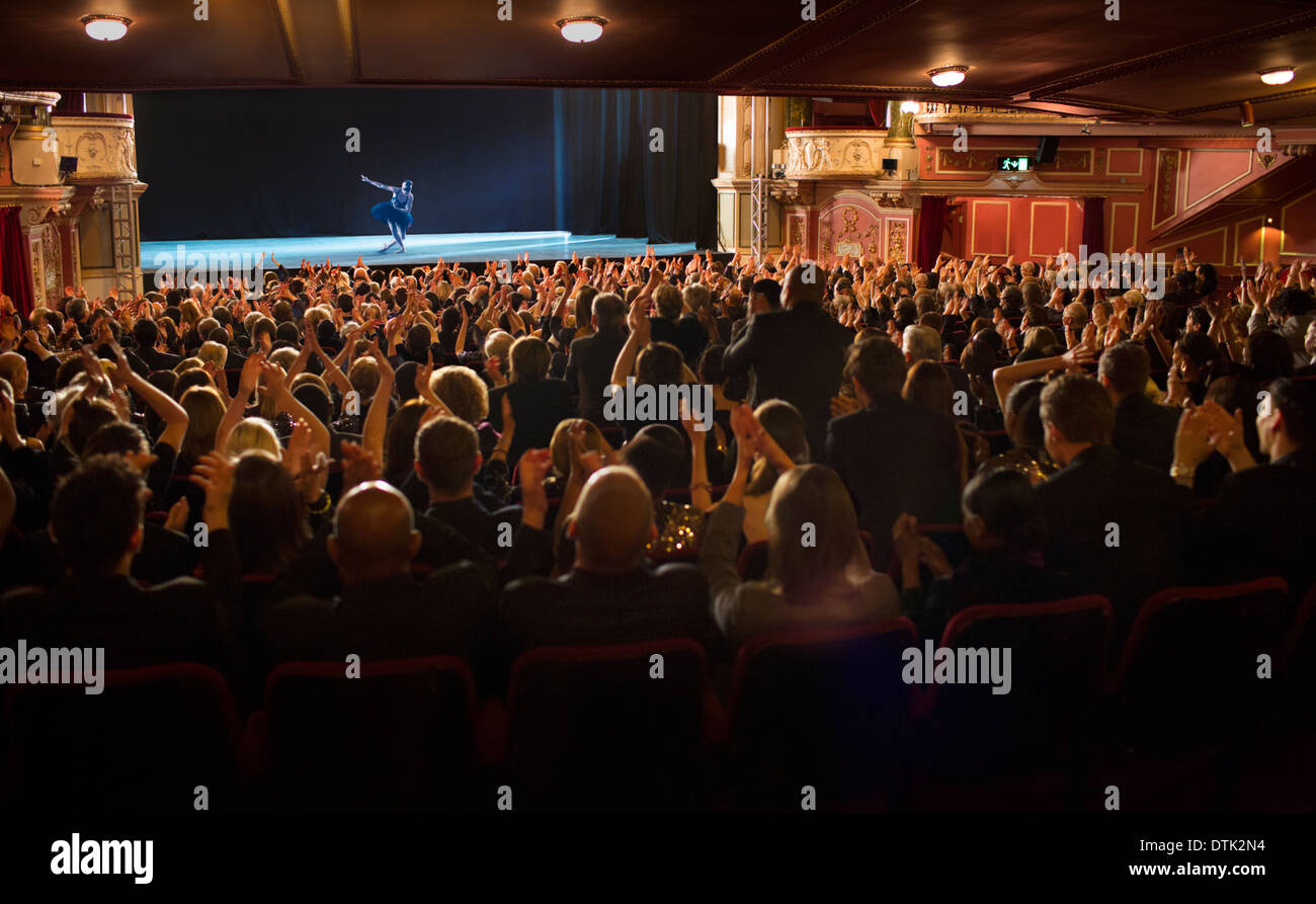 Audience applauding ballerina on stage in theater Stock Photo - Alamy